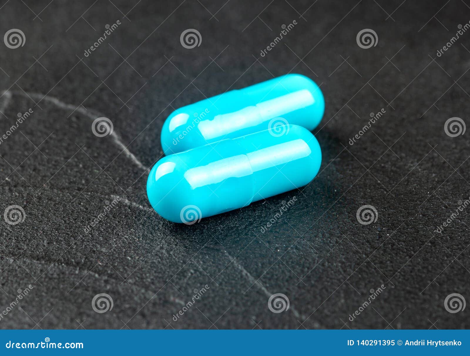 Two blue capsules stock image. Image of medication, heap - 140291395
