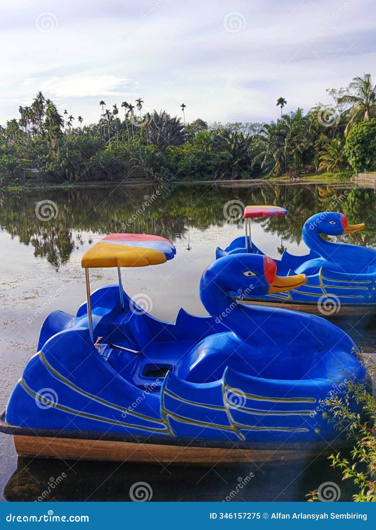 Two Blue Duck Boats on the Lake Stock Image - Image of lake, boats ...