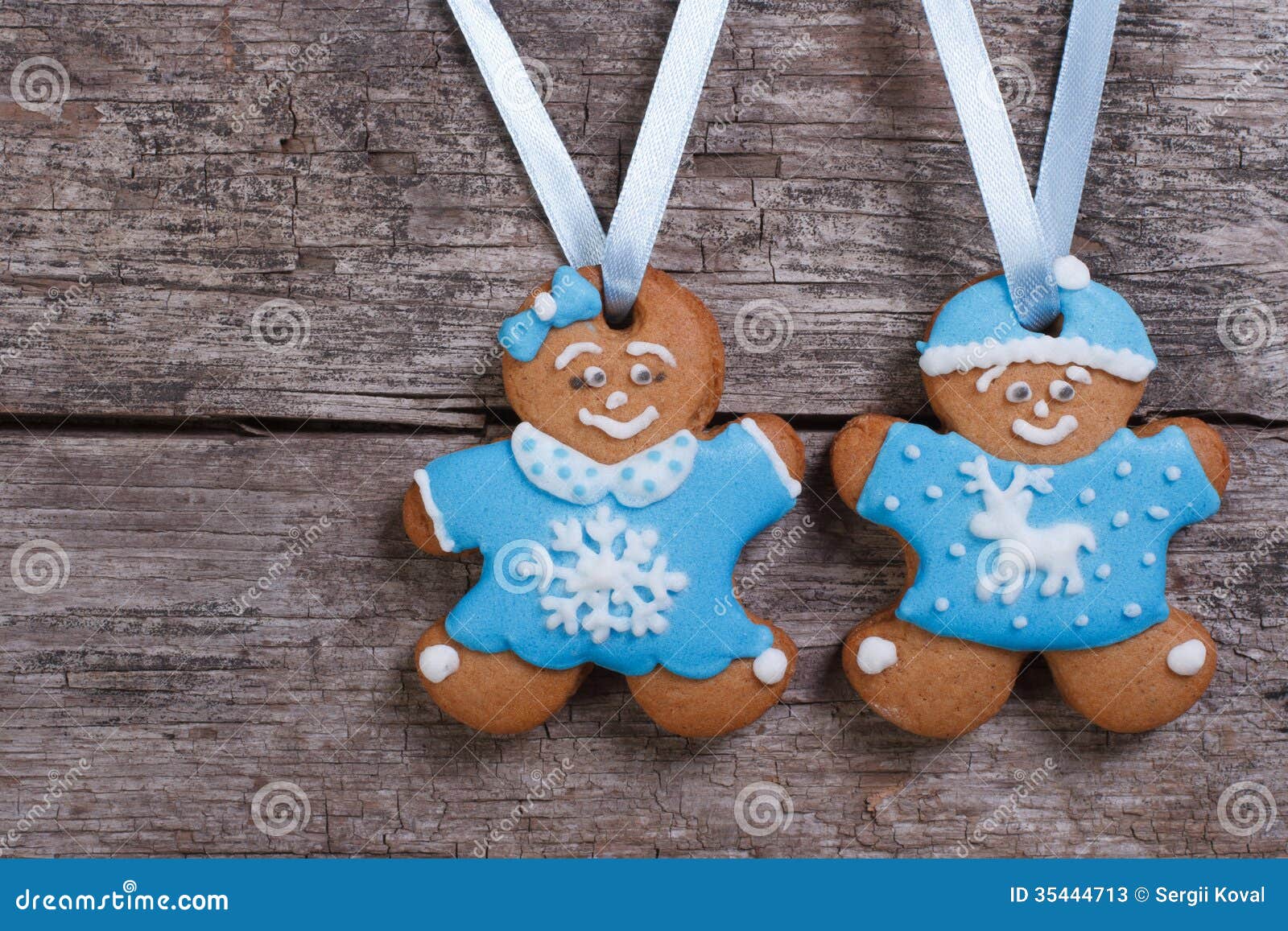 Two blue gingerbread men. stock image. Image of handmade - 35444713