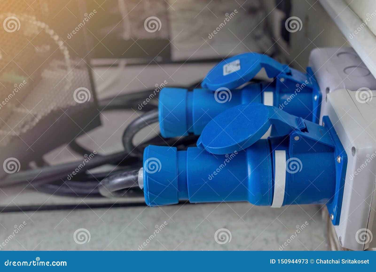 Two Blue High-voltage Power Sockets and Plugs are Plugged into the ...