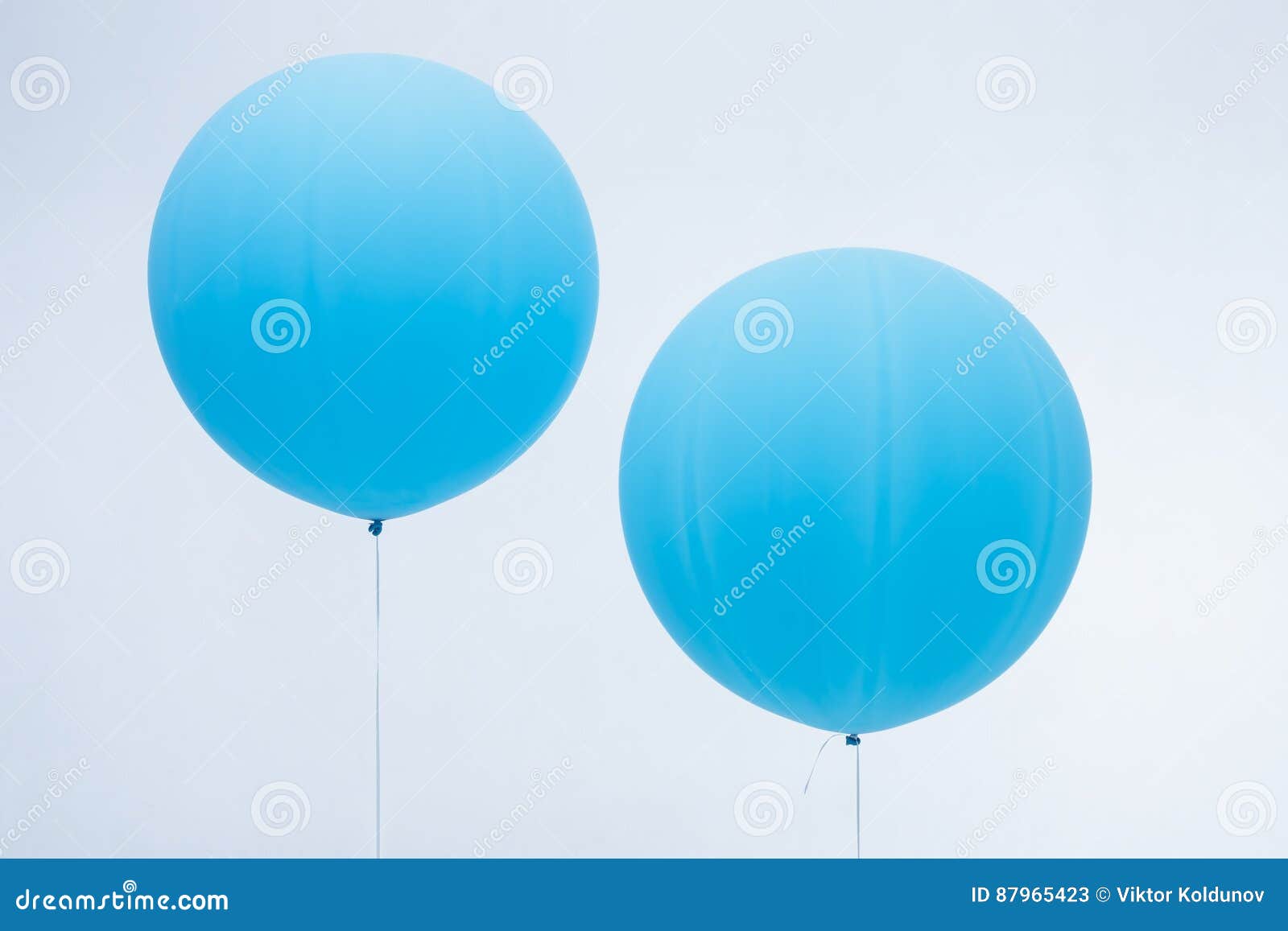 Two blue inflated balloons stock image. Image of decoration - 87965423