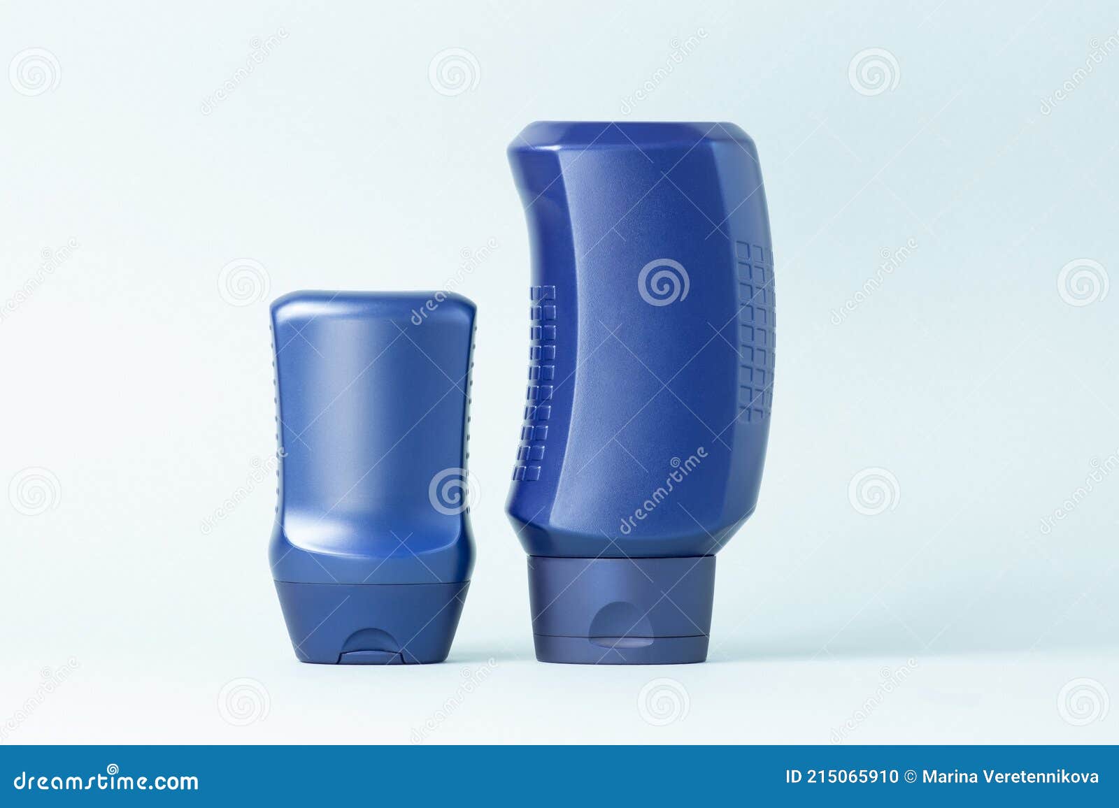 Two Blue Plastic Bottles of Cosmetics on a Blue Background. Stock Photo ...