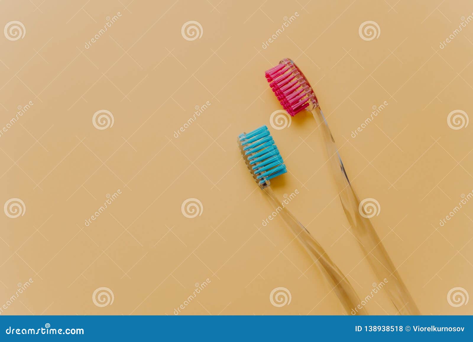Two Blue and Red Plastic Toothbrushes Isolated Over Yellow Background ...