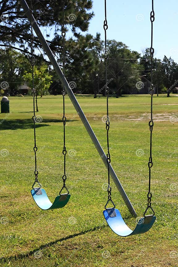 Two Blue Swings stock photo. Image of playgrounds, empty - 6492484