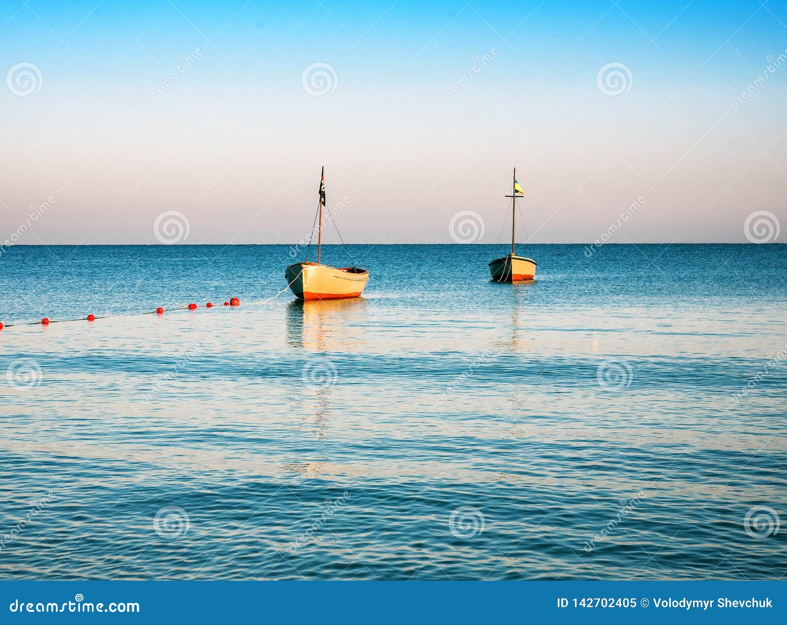 Two boats in a calm sea stock image. Image of relax - 142702405
