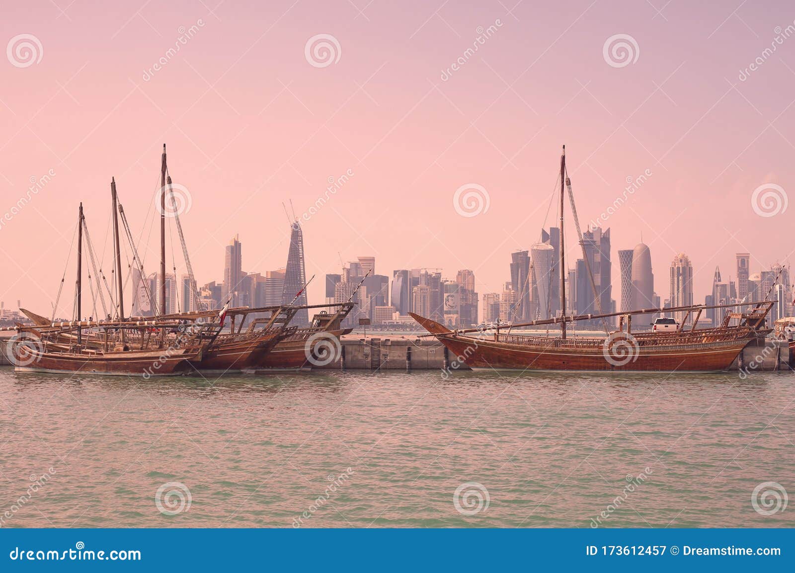 Two boats by Doha Corniche editorial photography. Image of buildings ...