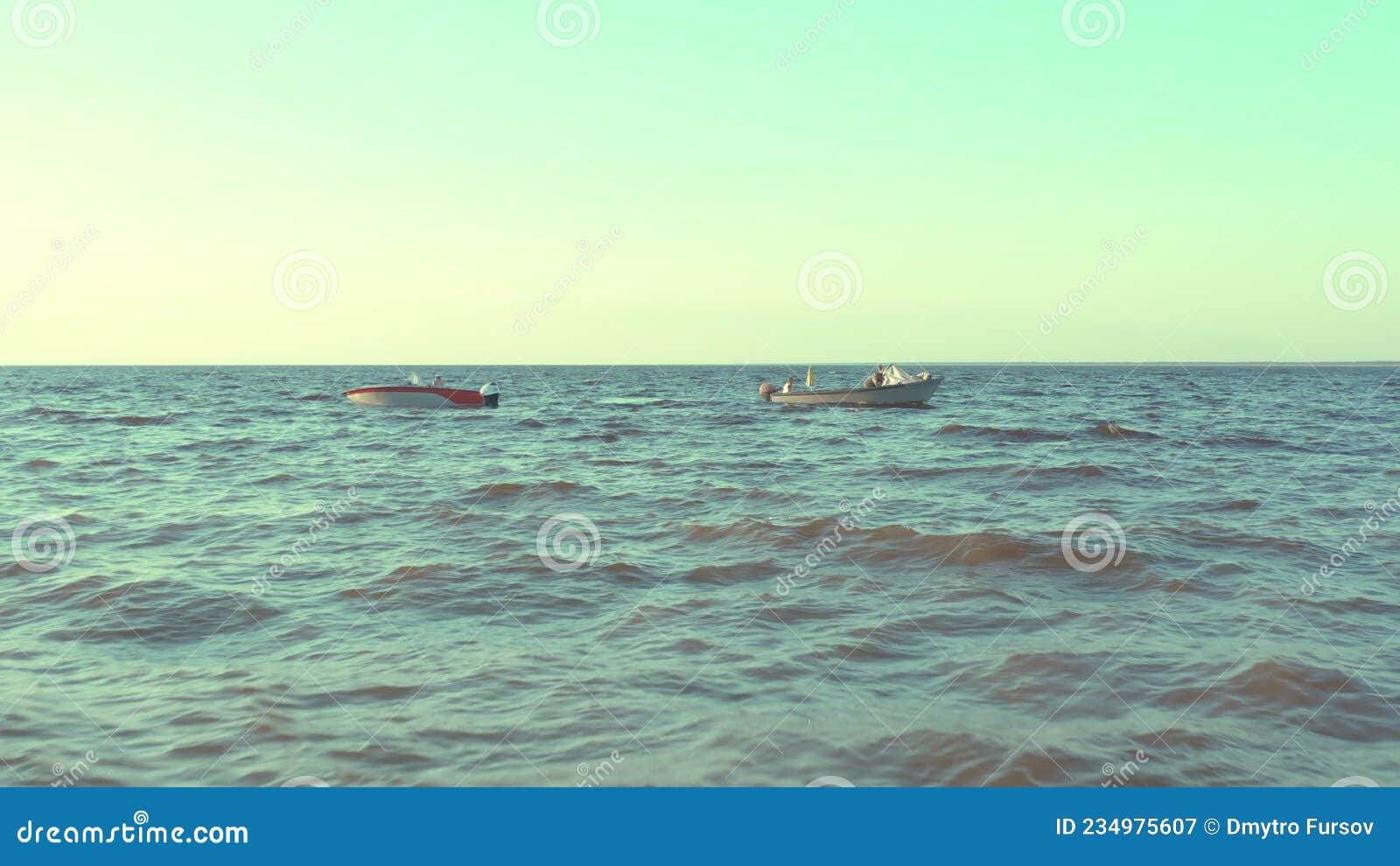 Two Boats Float in Different Directions in the Sea on the Waves. Stock ...