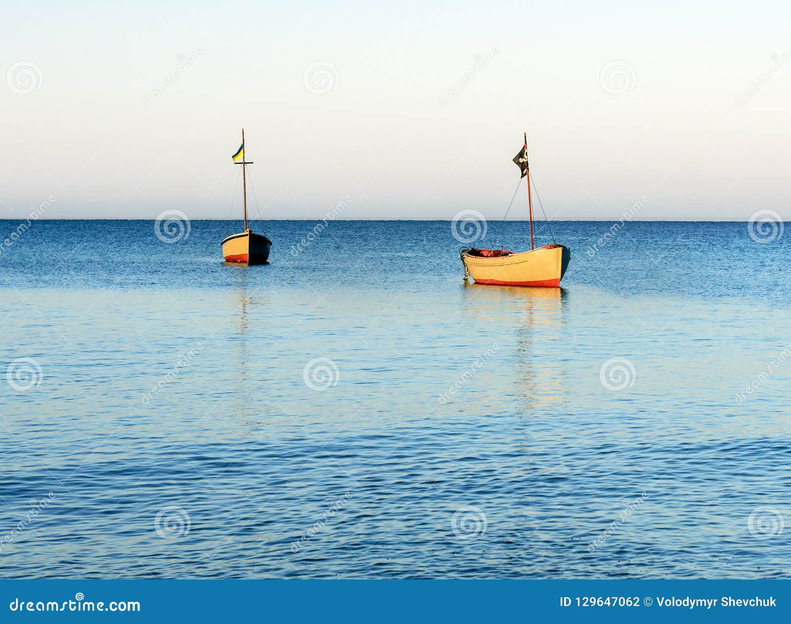 Two boats in the sea stock photo. Image of sailboat - 129647062