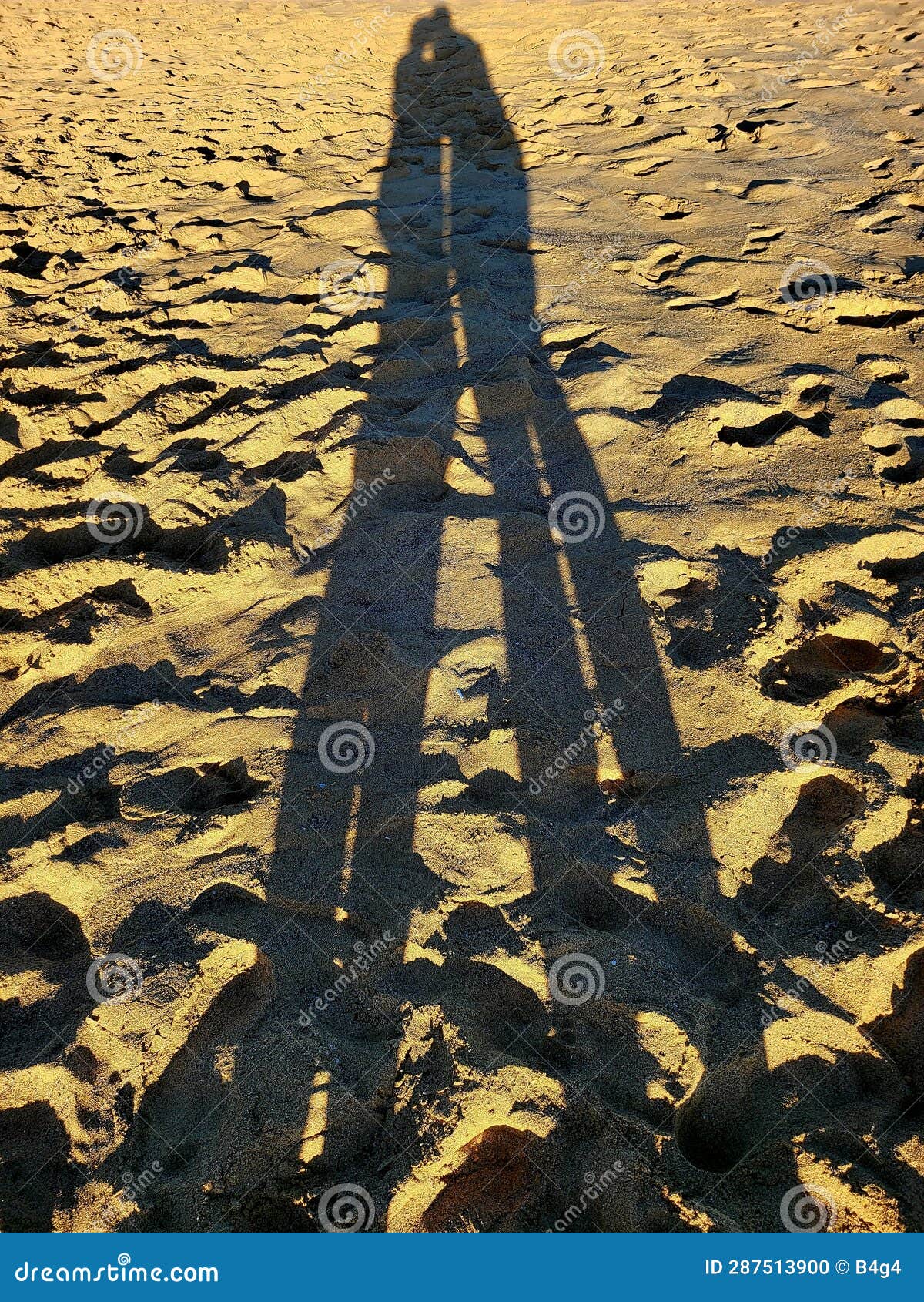 Two Bodies Cast a Romantic Shadow on the Sand Stock Photo - Image of ...