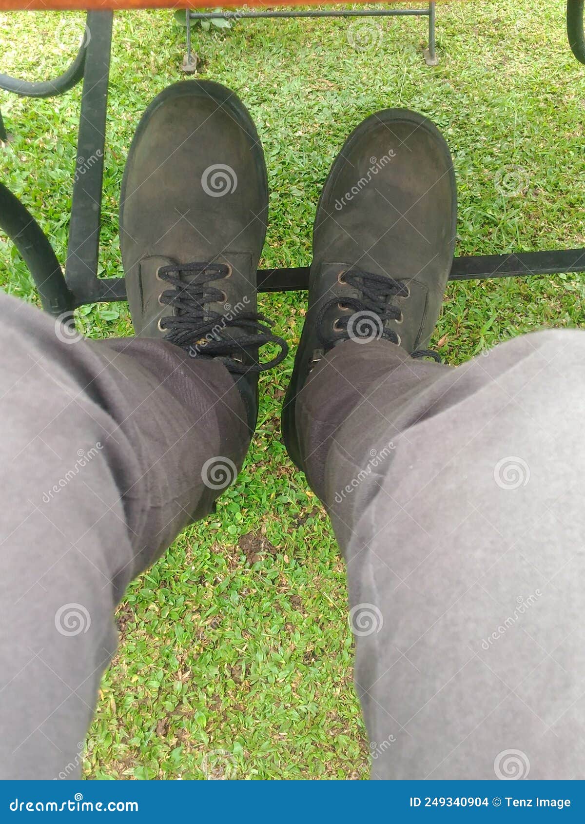 Two Boots under the table stock photo. Image of iron - 249340904