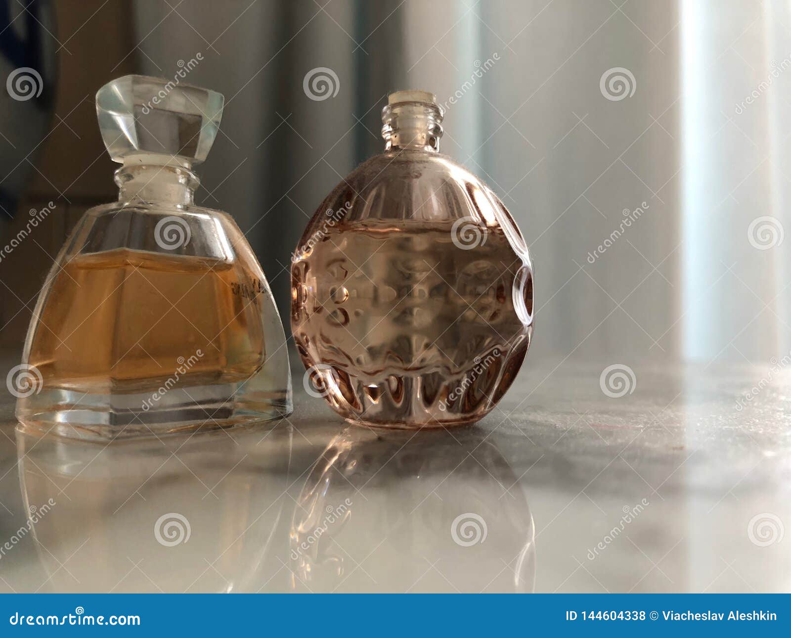 Two bottles of perfume stock photo. Image of fashion - 144604338