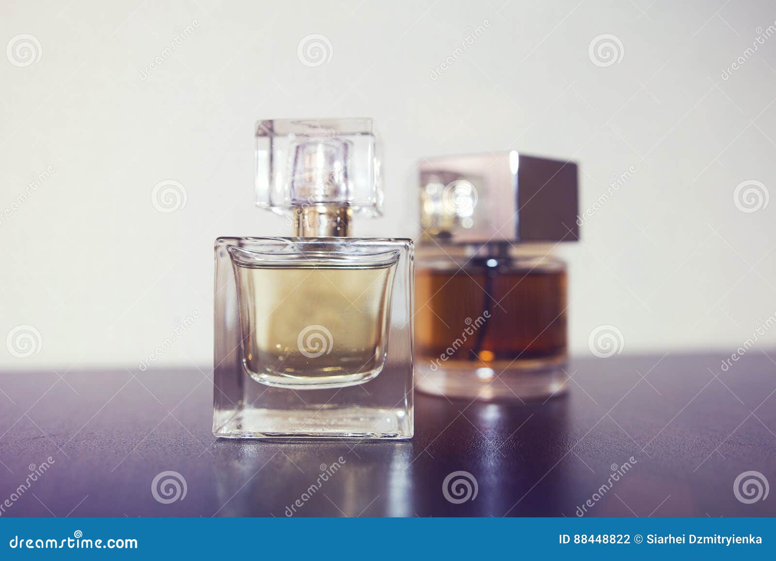 Two Bottles of Perfume on the Table. Stock Photo - Image of care ...
