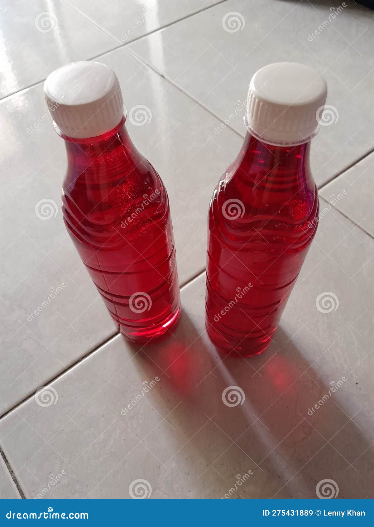 Two bottles of red syrup stock image. Image of syrupbottle - 275431889
