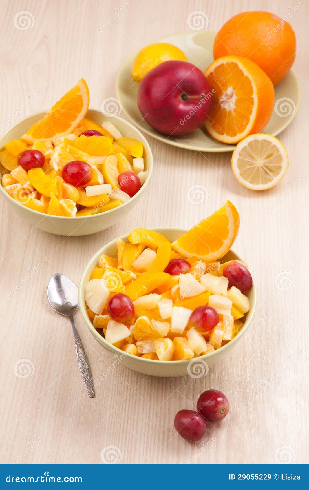 Two Bowls with Fruit Salad on Wooden Table with Spoon Stock Image ...