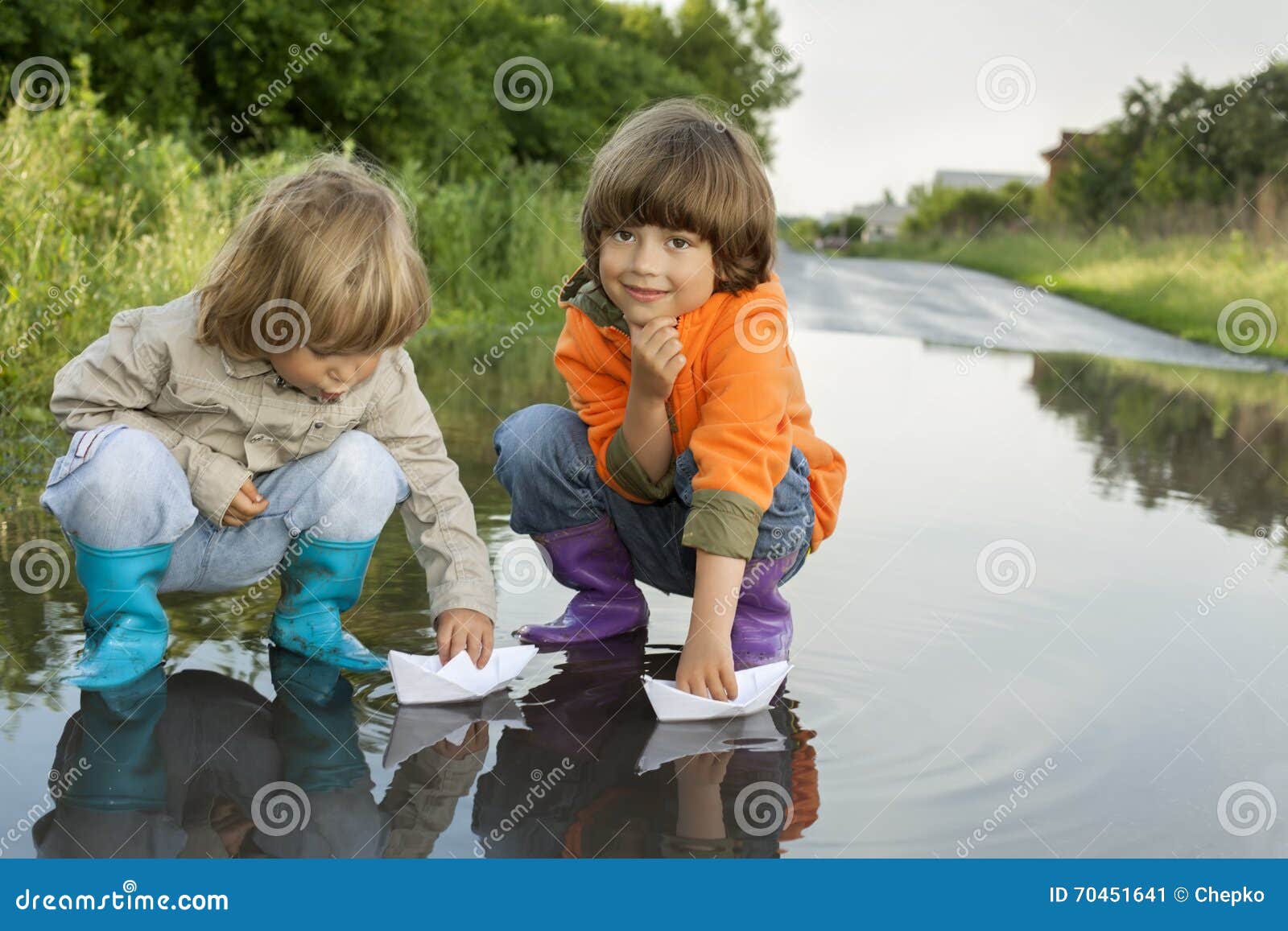 Two boy play in puddle stock image. Image of kids, happiness - 70451641
