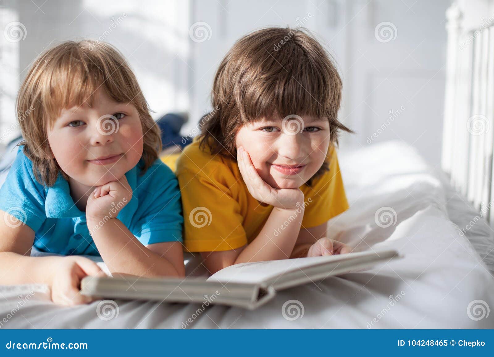 Two boy read book indoors stock image. Image of homework - 104248465