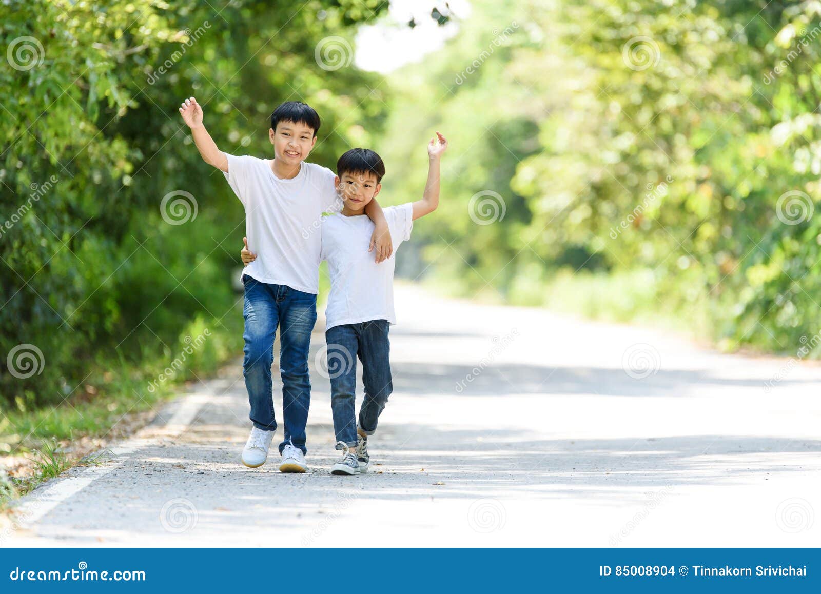 Two boy run in the park stock photo. Image of hello, warm - 85008904