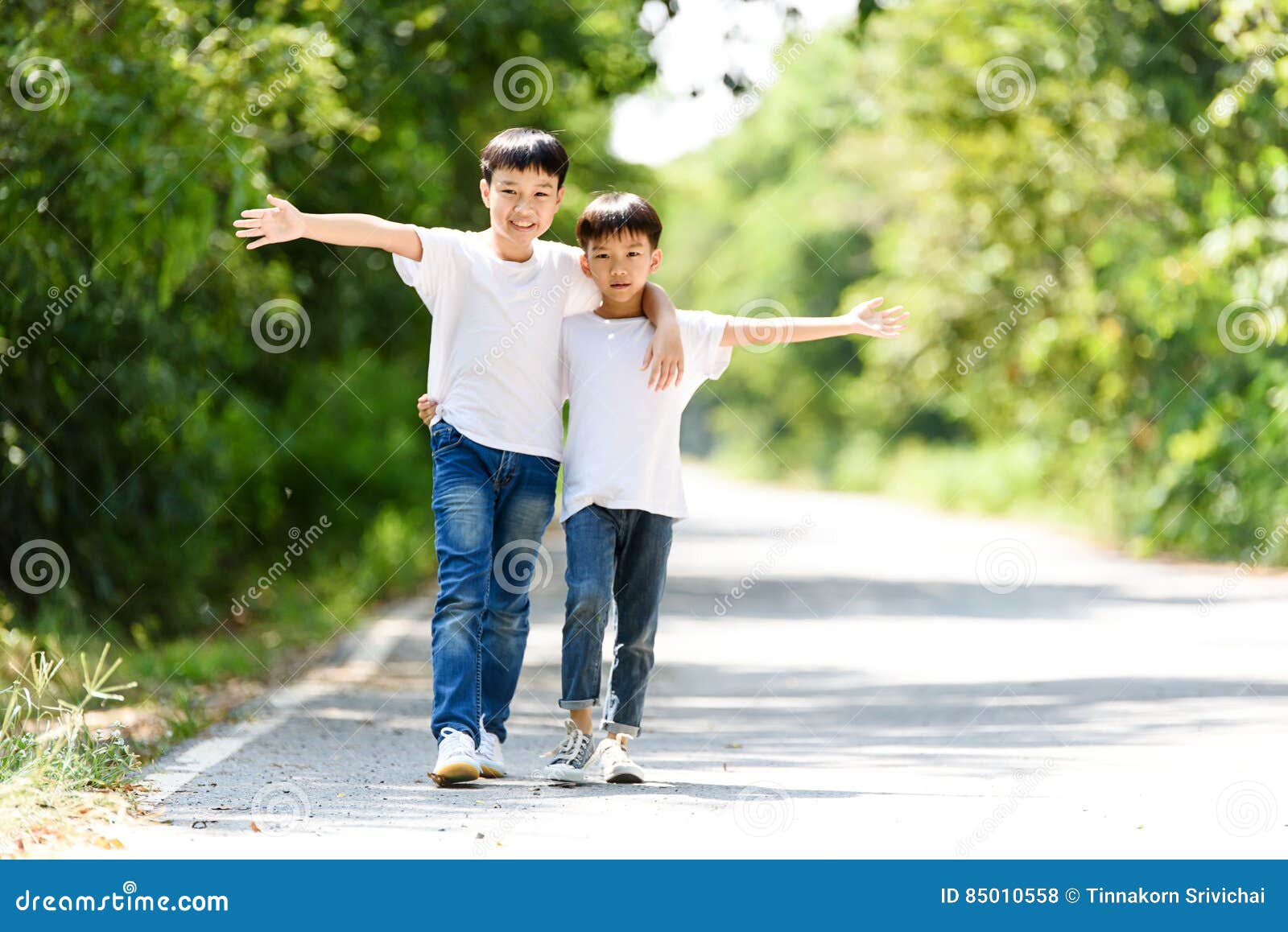 Two boy run in the park stock photo. Image of rock, blue - 85010558