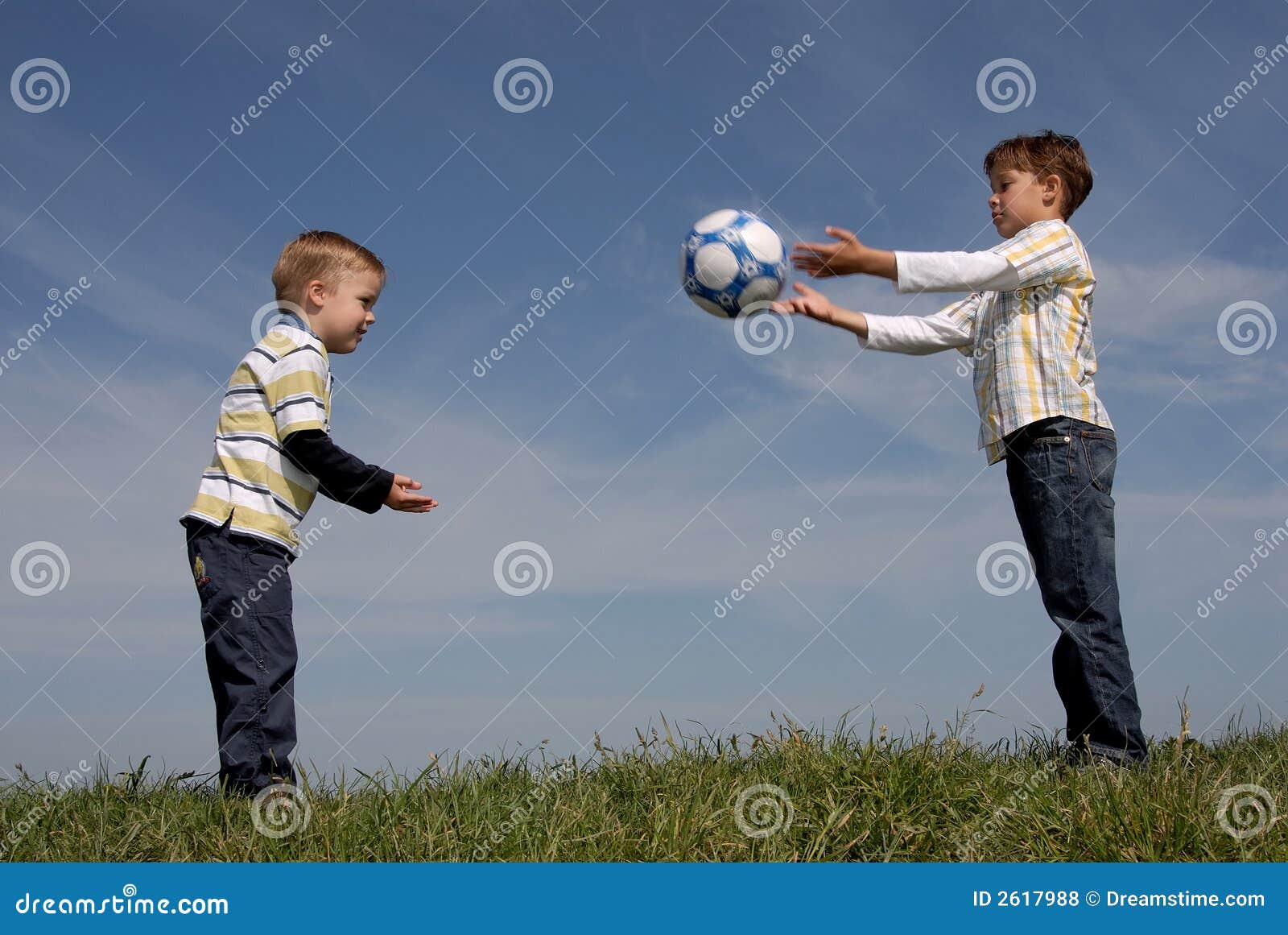 Two boys with a ball stock photo. Image of freedom, throwing - 2617988