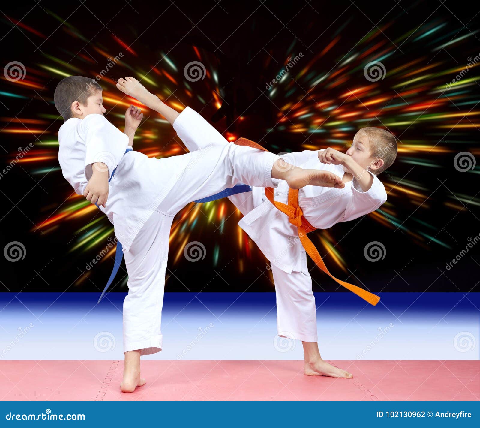 Two Boys Beat Kicks in the Background of Bright Rays Stock Photo ...