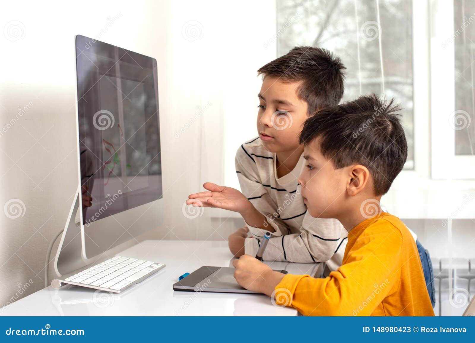 Two Boys Boys Doing Their Homework with a Computer. they Drawing on a ...