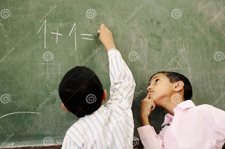 Two Boys in Classroom Thinking Stock Image - Image of chalkboard ...