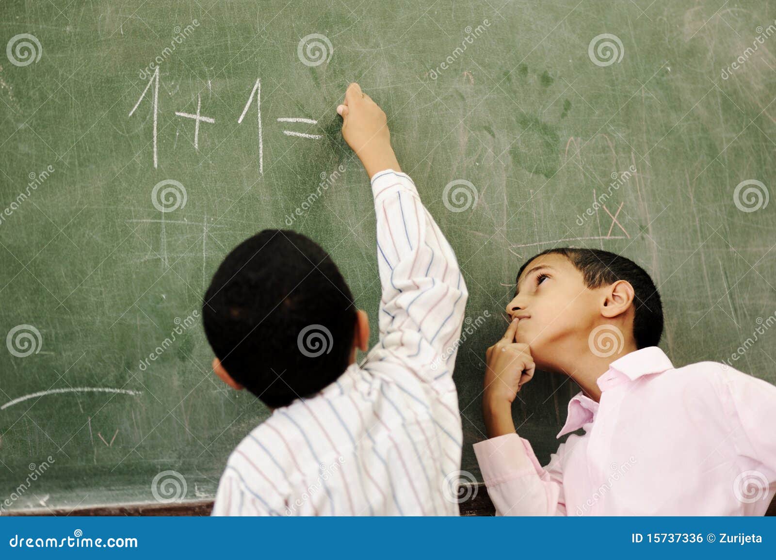 Two Boys in Classroom Thinking, Writing and Counti Stock Photo - Image ...