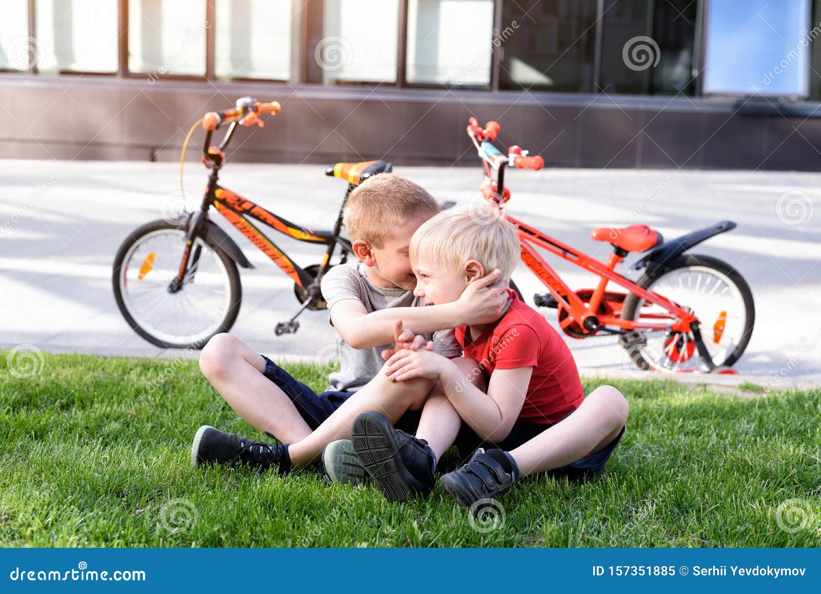 Two Boys Communicate Sitting on the Grass. Rest after Cycling, Bicycles ...