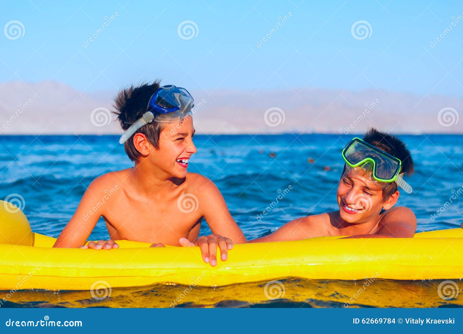 Two Boys Enjoy Their Time on the Beach Stock Photo - Image of diving ...