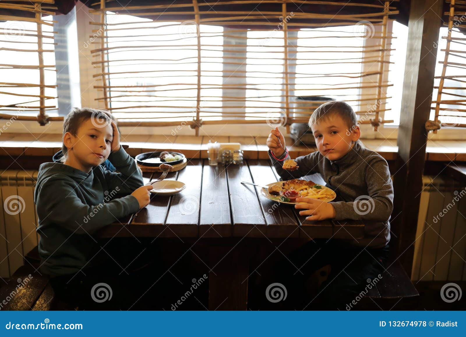 Two boys have lunch stock photo. Image of culture, leisure - 132674978