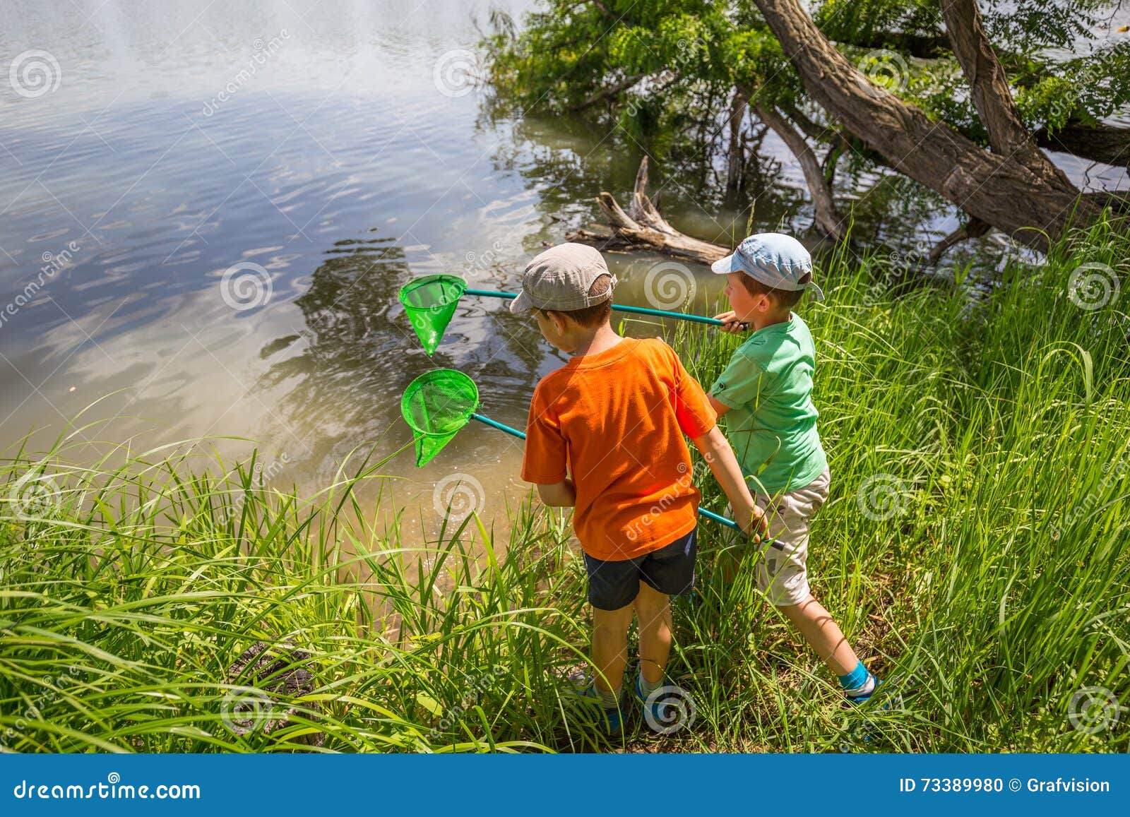 Two boys having fun stock photo. Image of happiness, fishing - 73389980