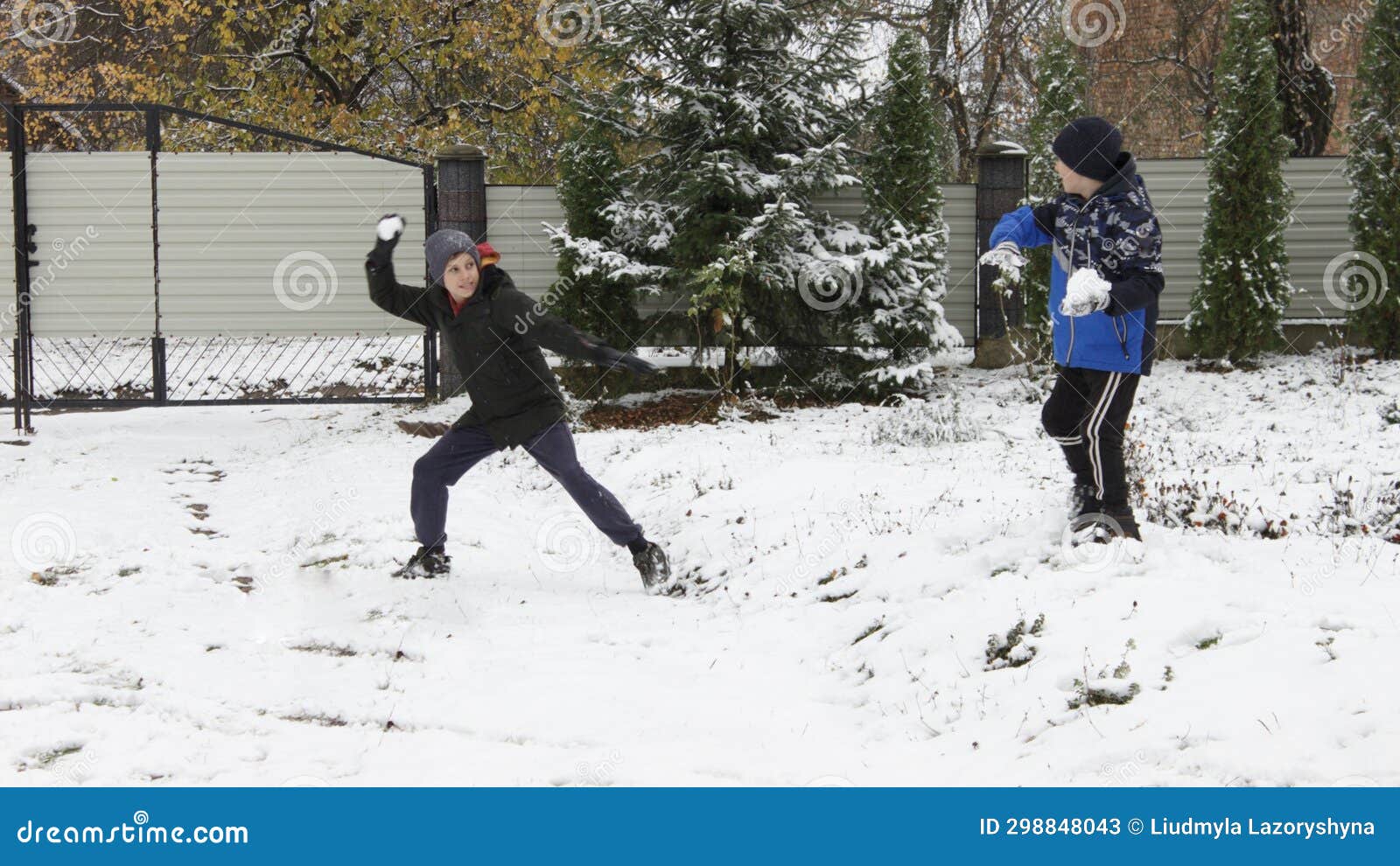 Two Boys are Having Fun Playing Snowball Games in the Snow Stock Image ...
