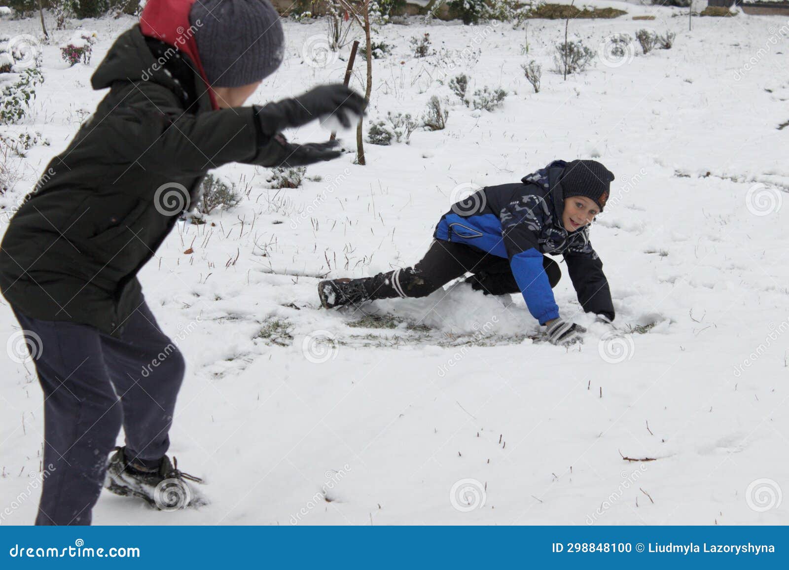 Two Boys are Having Fun Playing Snowball Games in the Snow Stock Photo ...
