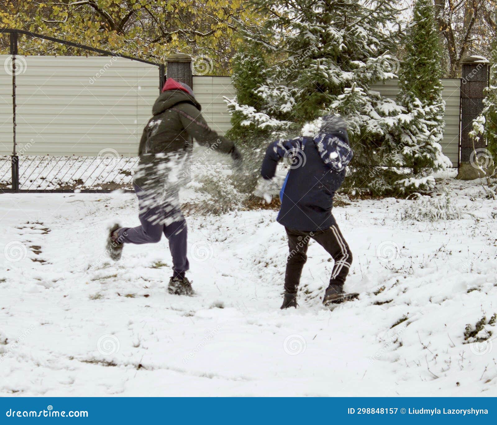 Two Boys are Having Fun Playing Snowball Games in the Snow Stock Image ...