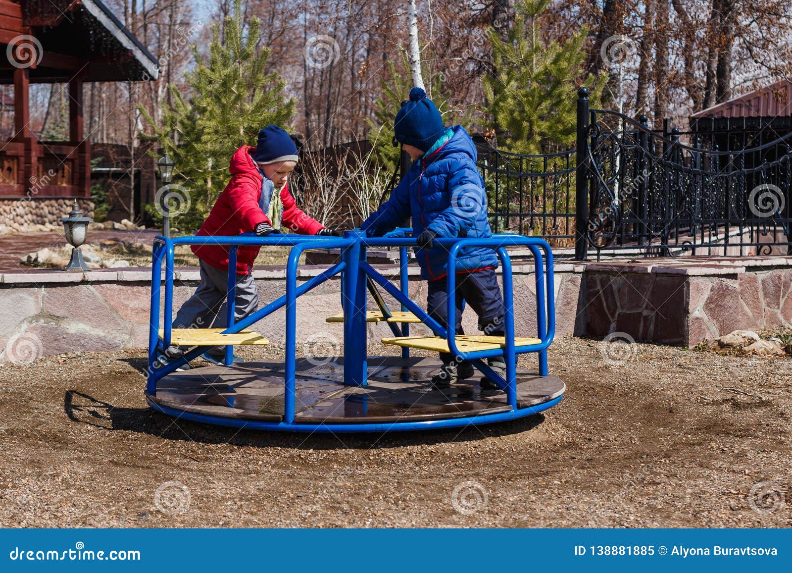 Two Boys in Jackets Play in the Playground Stock Image - Image of ...