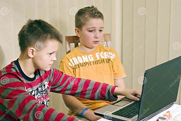 Two Boys and Laptop Computer Stock Image - Image of attitude, help: 3811855