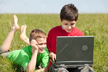 Two Boys with Laptop on the Grass Stock Image - Image of laptop ...