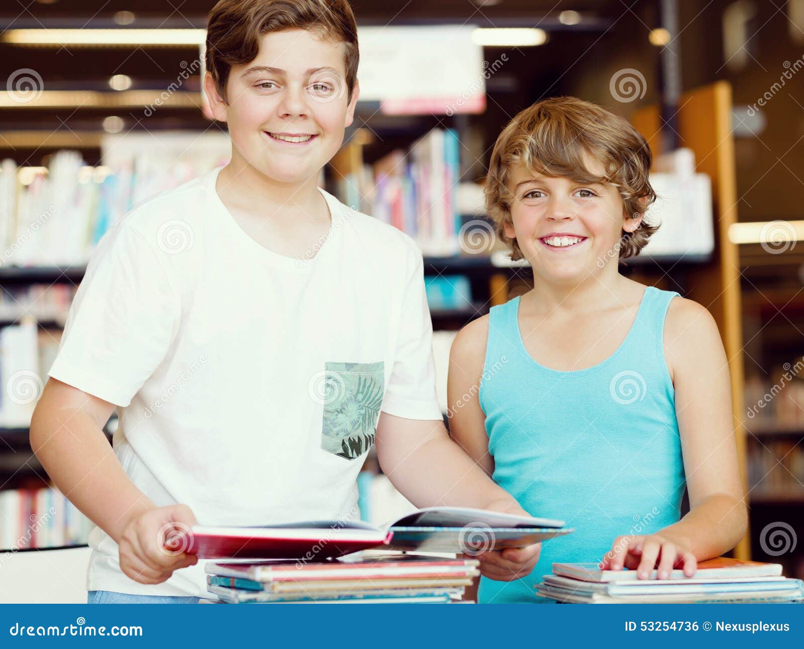 Two boys in library stock photo. Image of happy, literature - 53254736