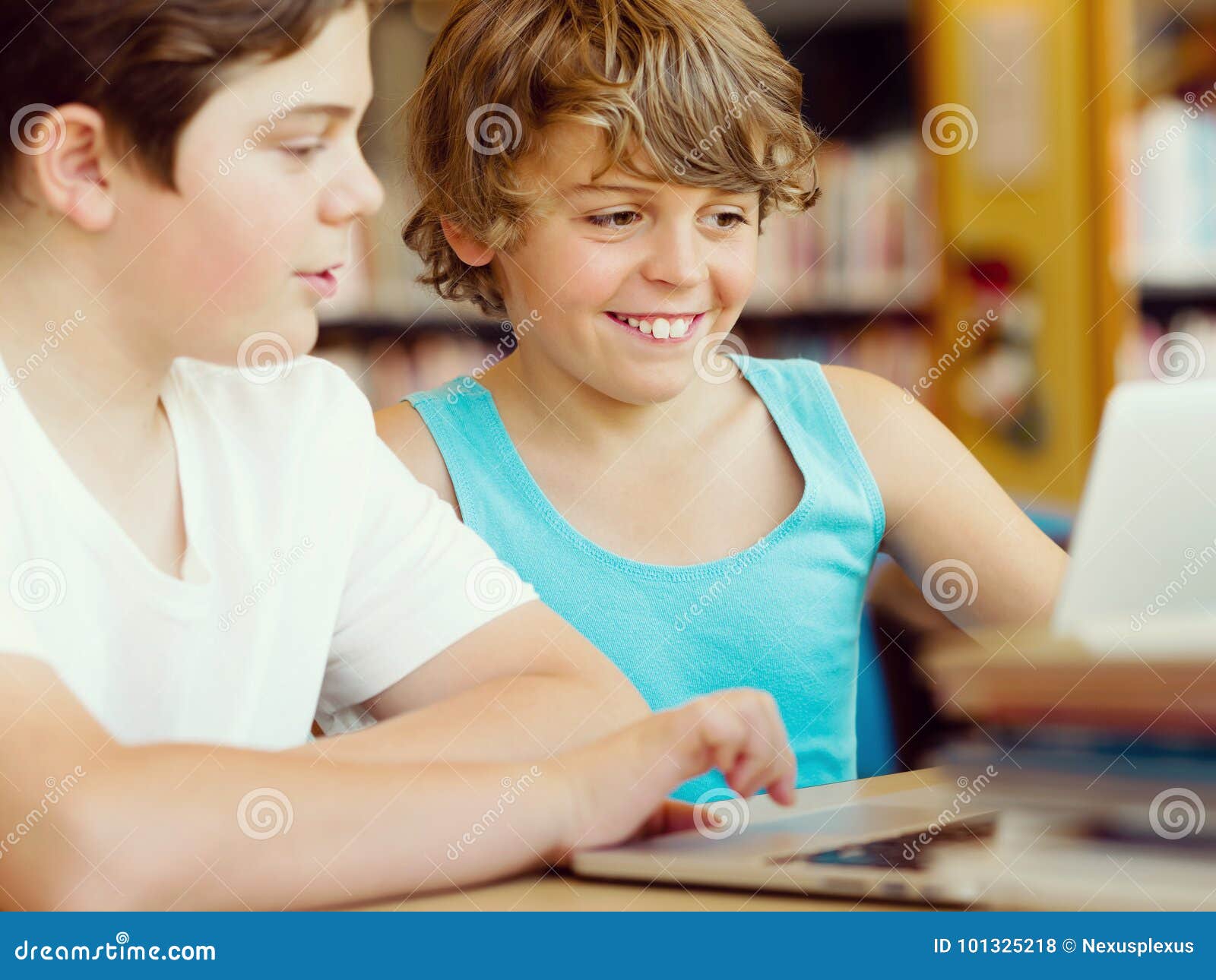 Two boys in library stock photo. Image of learn, ebook - 101325218