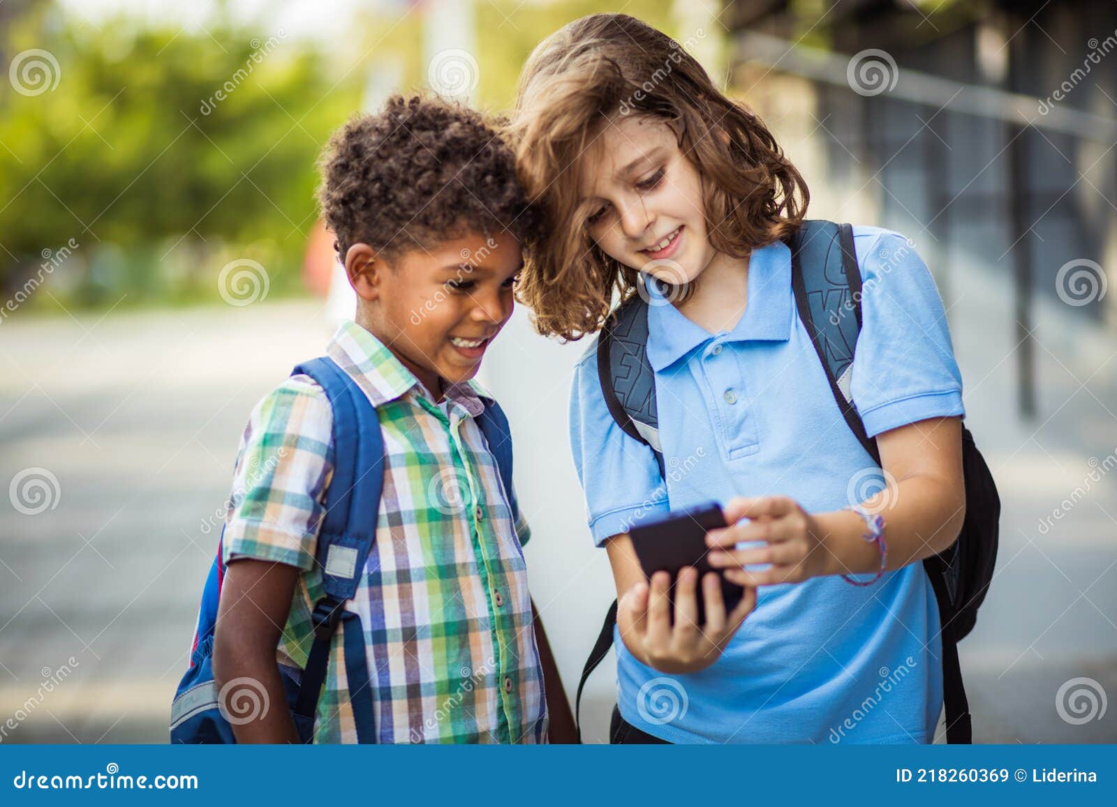 Two Boys Looking at the Phone Stock Image - Image of people, phone ...