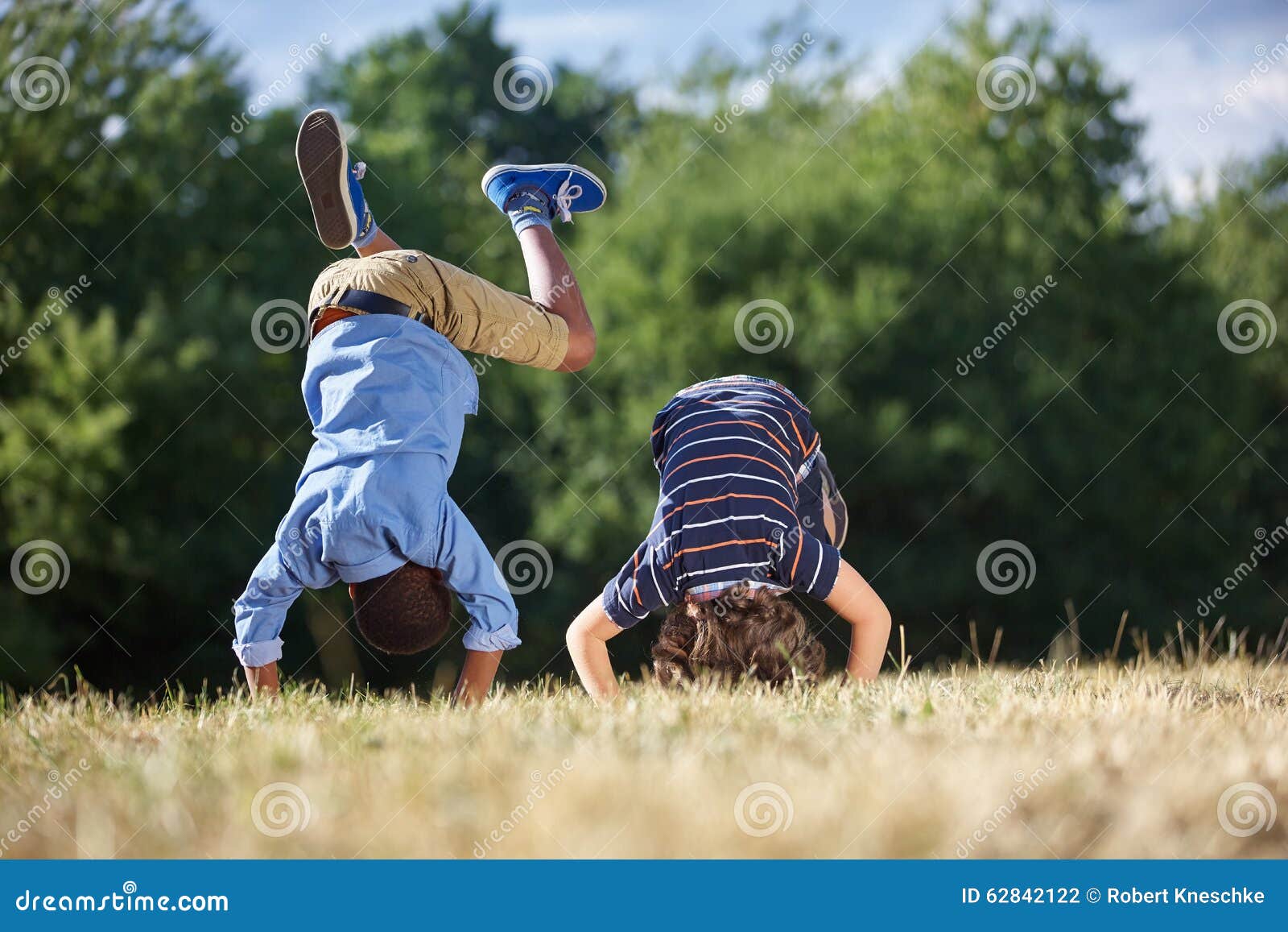 Two Boys Making a Somersault Stock Photo - Image of nature ...