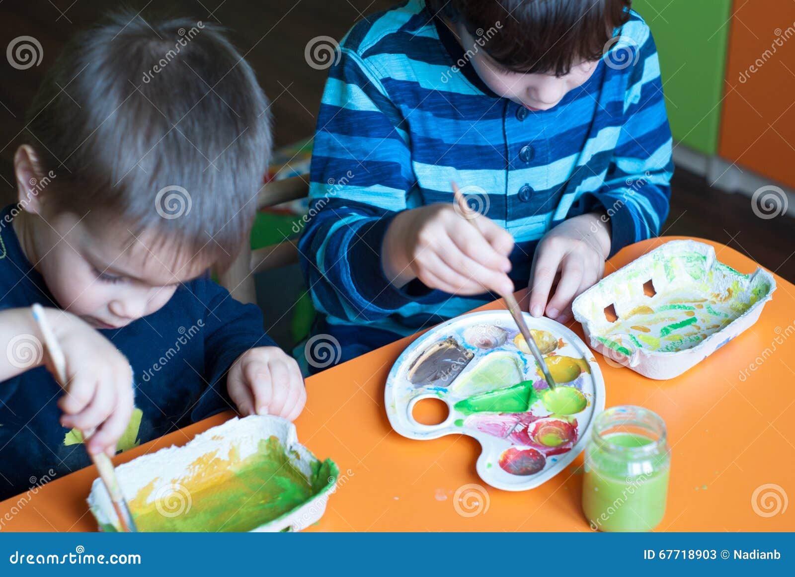 Two boys painting stock image. Image of creation, handmade - 67718903