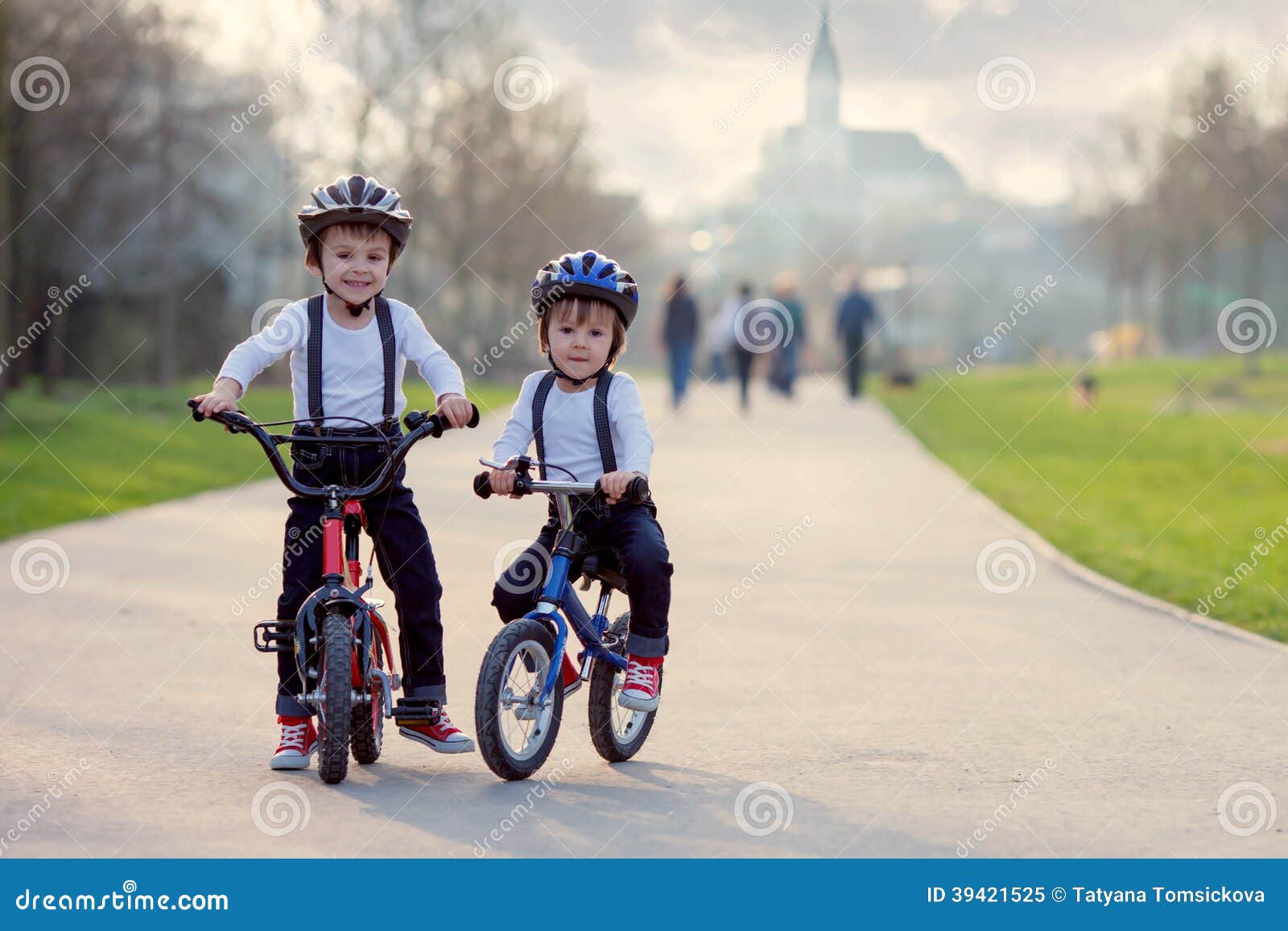Two Boys In The Park, Riding Bikes Stock Image - Image: 39421525