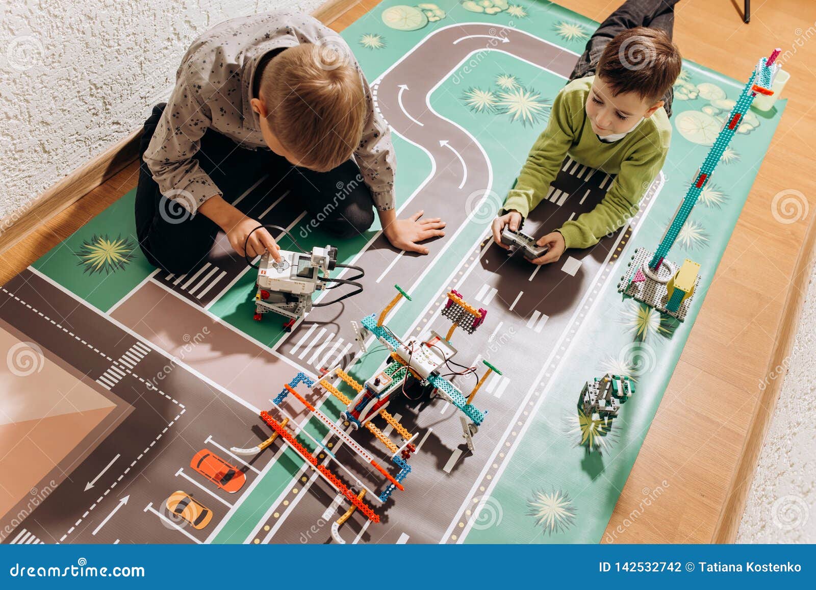 Two Boys Play with Robots that they Created from the Robotic ...