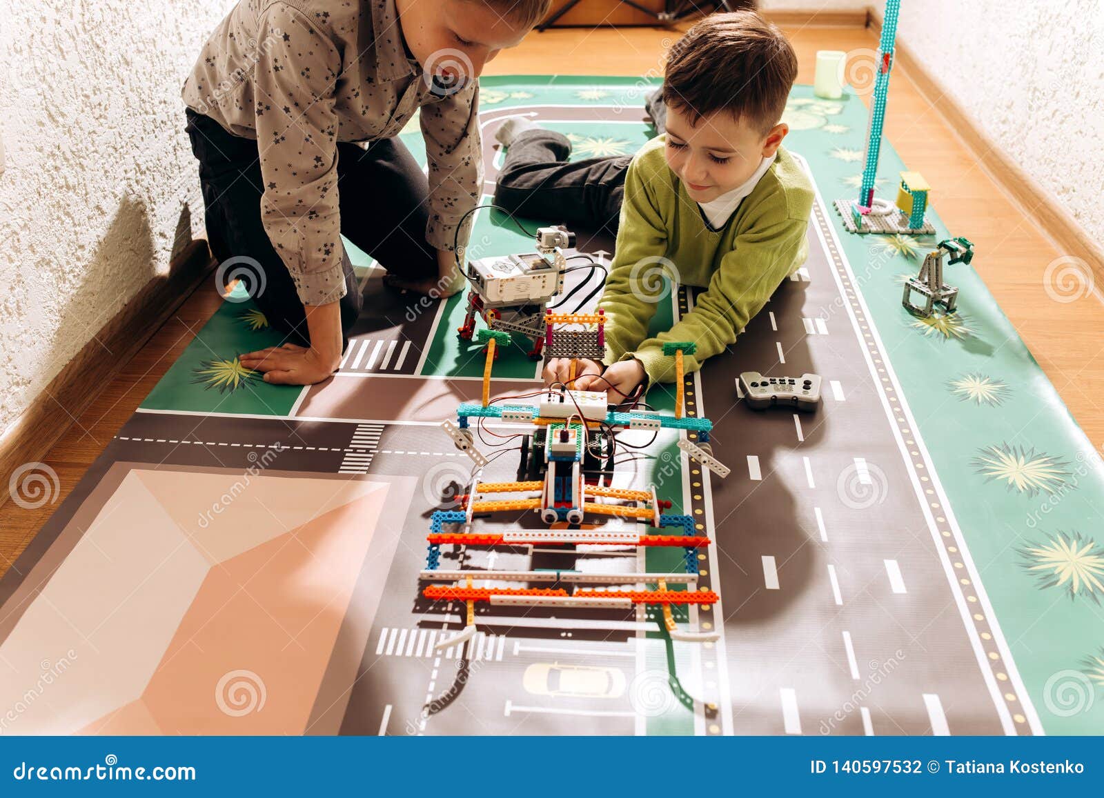 Two Boys Play with Robots that they Created from the Robotic ...