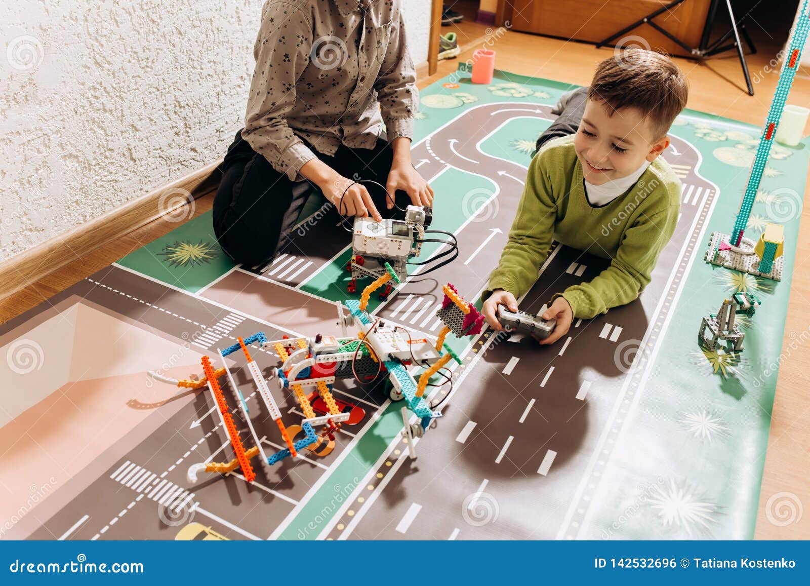 Two Boys Play with Robots that they Created from the Robotic ...