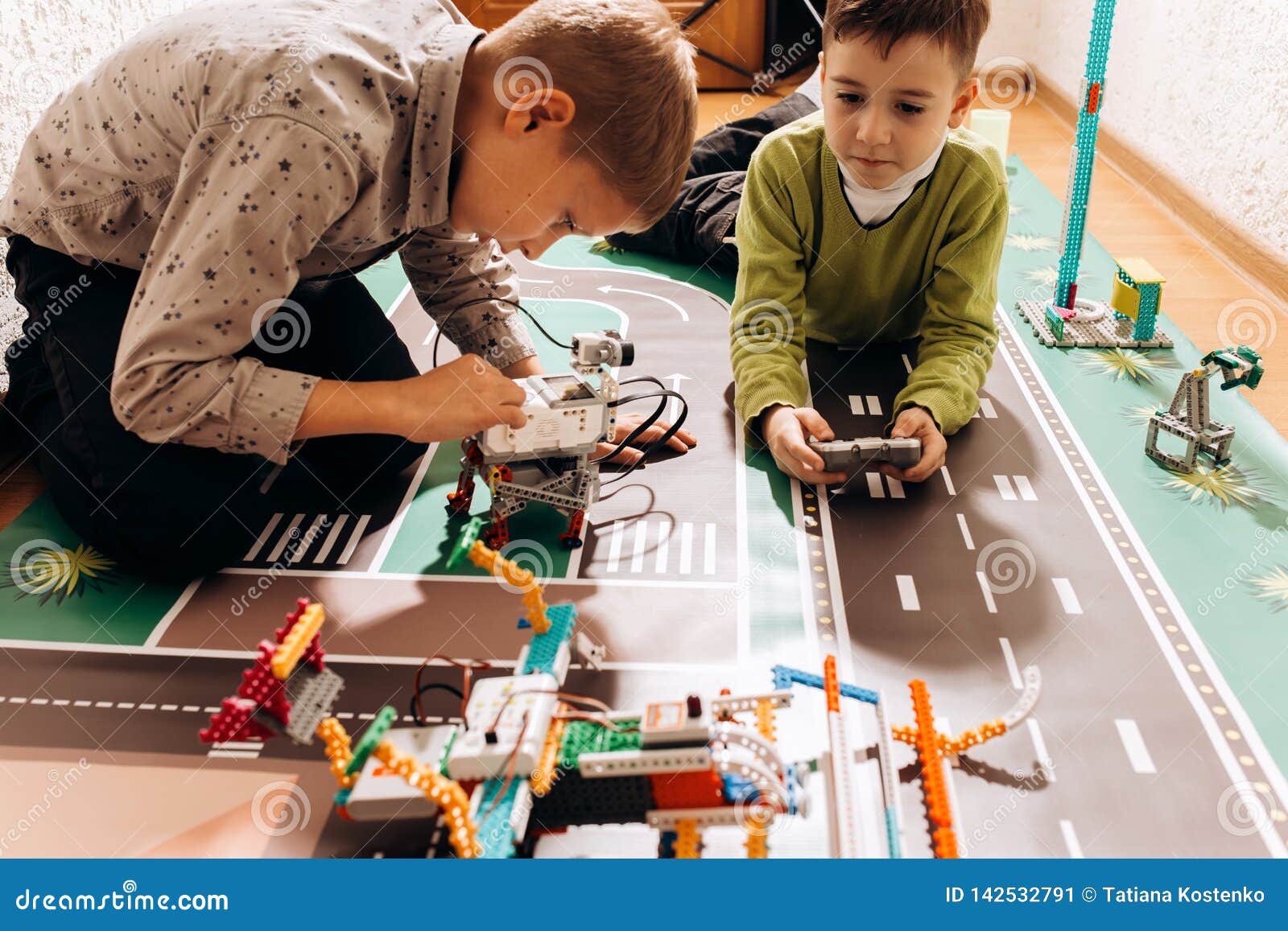 Two Boys Play with Robots that they Created from the Robotic ...