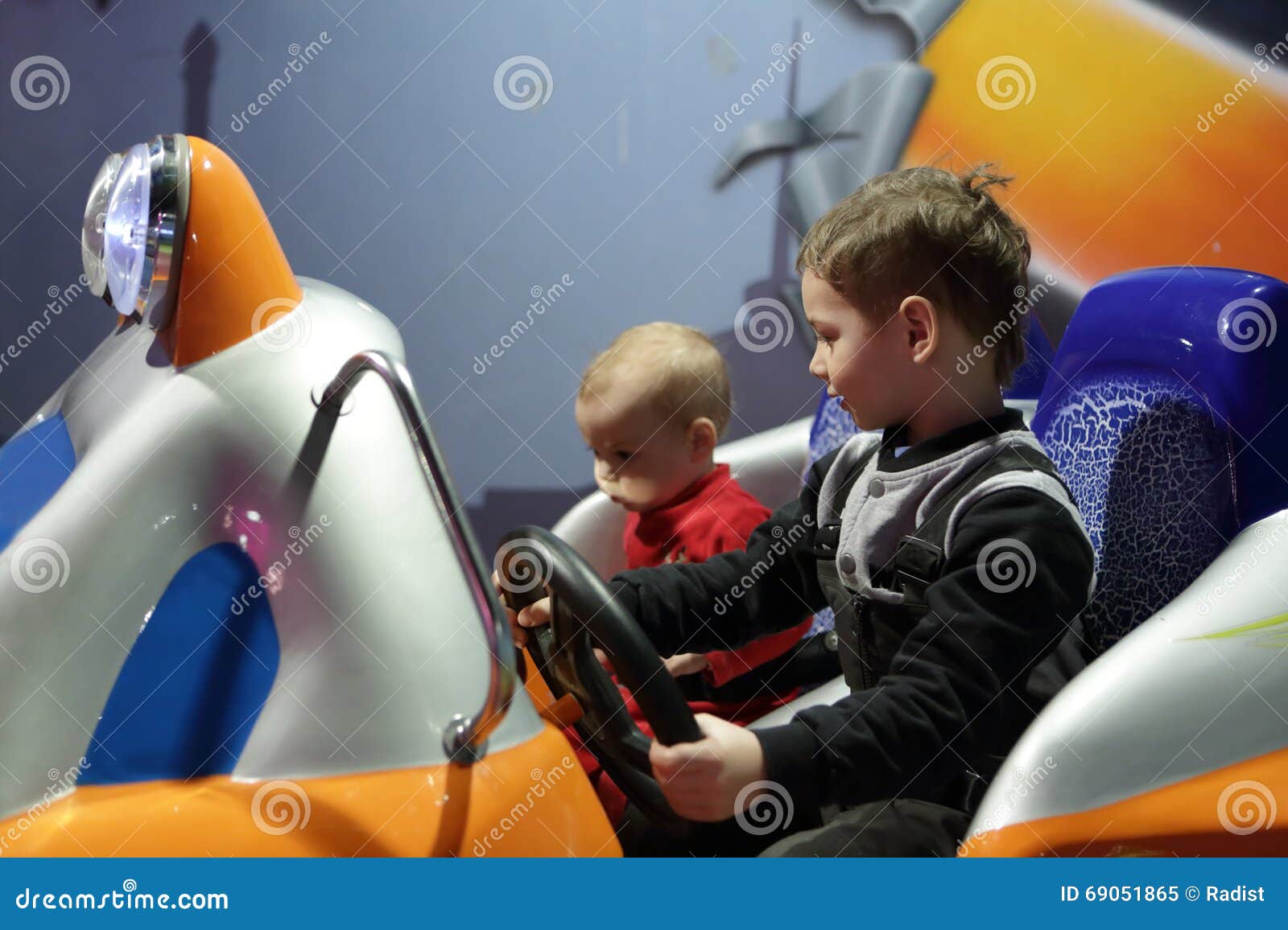 Two Boys Playing Arcade Game Machine Stock Image - Image of playful ...