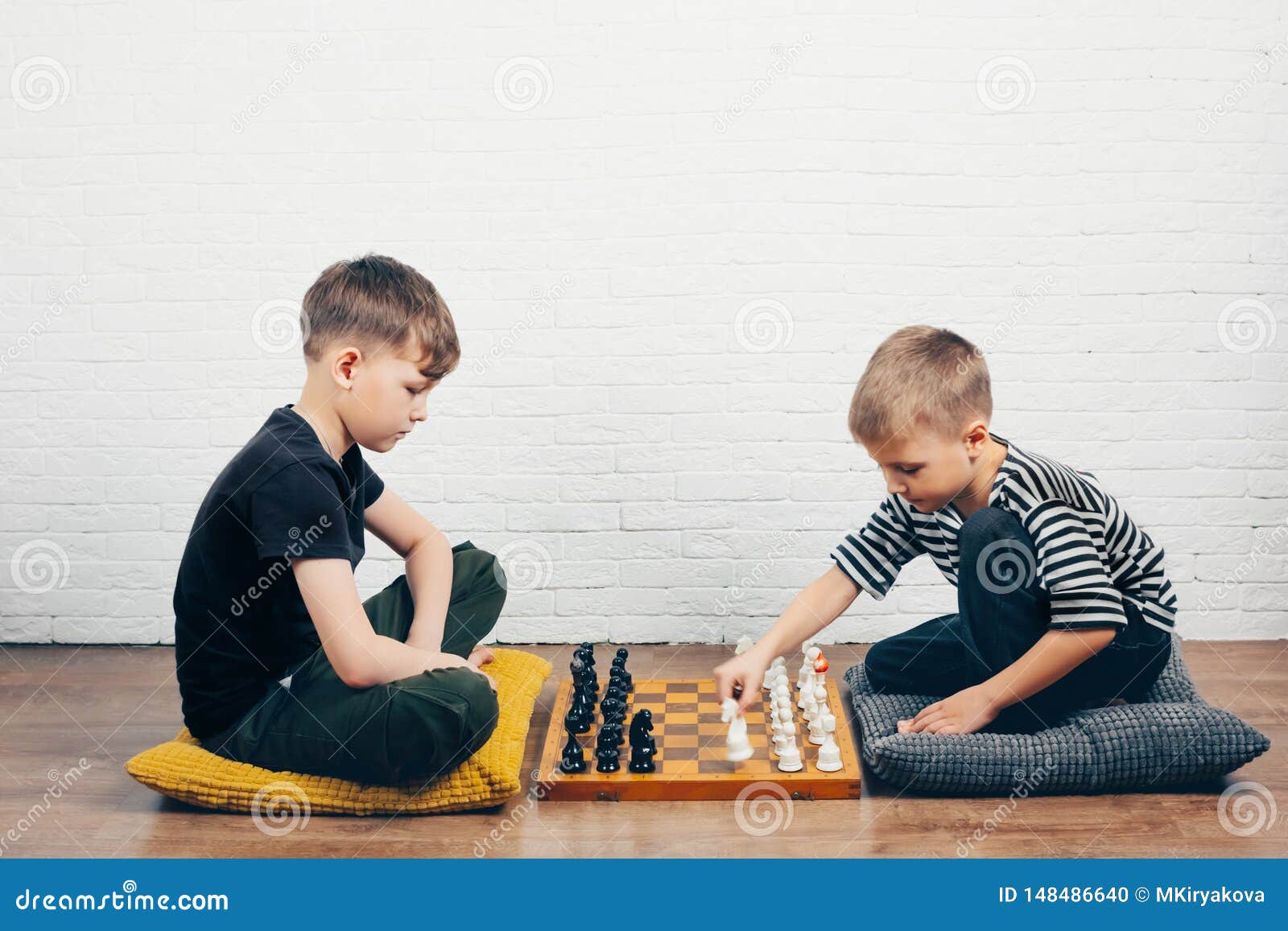 Two Boys Playing Chess at Home on the Floor. Stock Photo - Image of ...