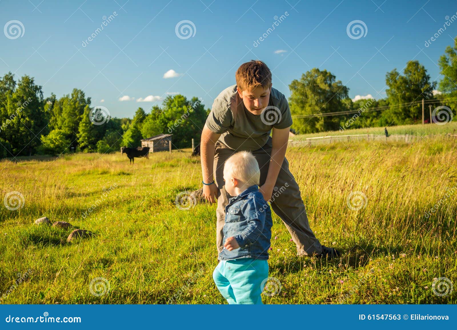 Two Boys Playing on a Meadow. Stock Image - Image of meadow, village ...